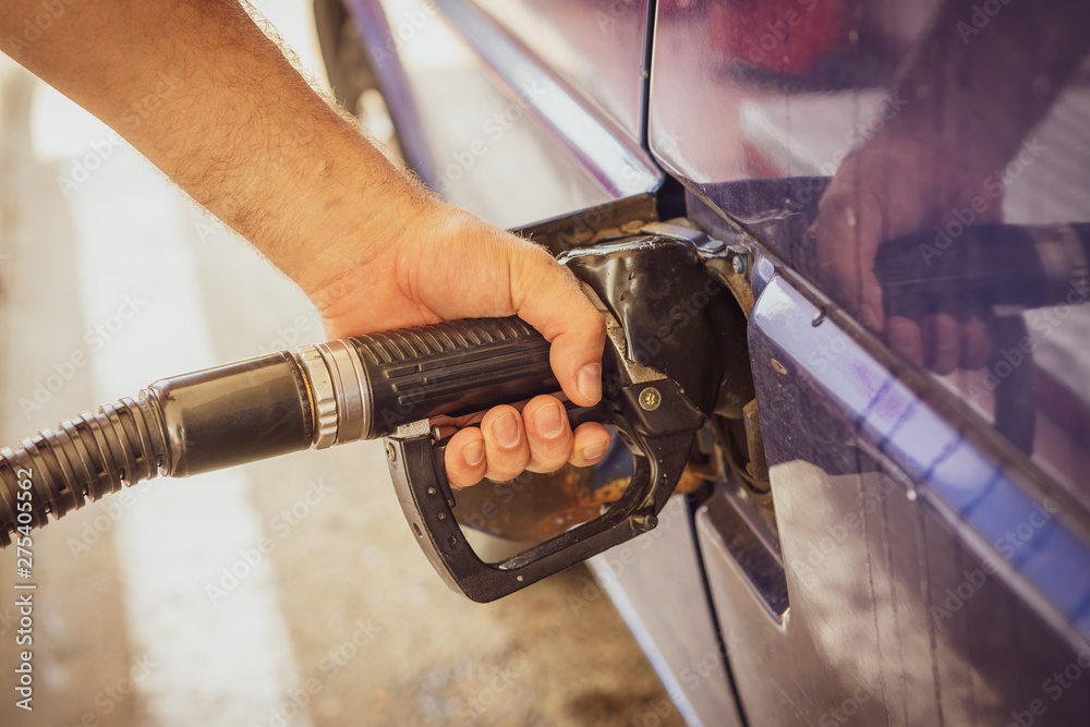 Refueling car vehicle with fuel at refuel gas pump station - Petrol ...
