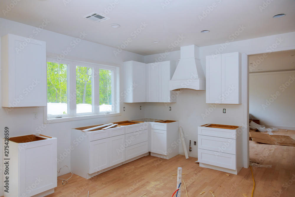 Interior design construction of a kitchen with cabinet maker installing ...