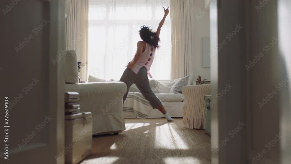 happy young woman dancing at home having fun celebrating with funny ...