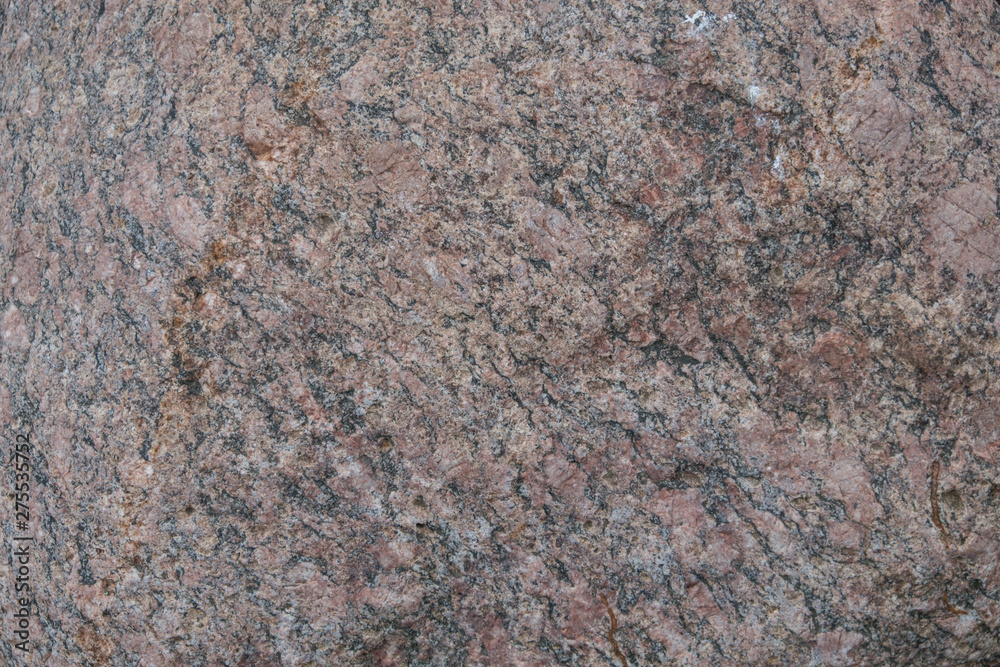 Background of natural stone. A snapshot of granite boulder (Latin ...
