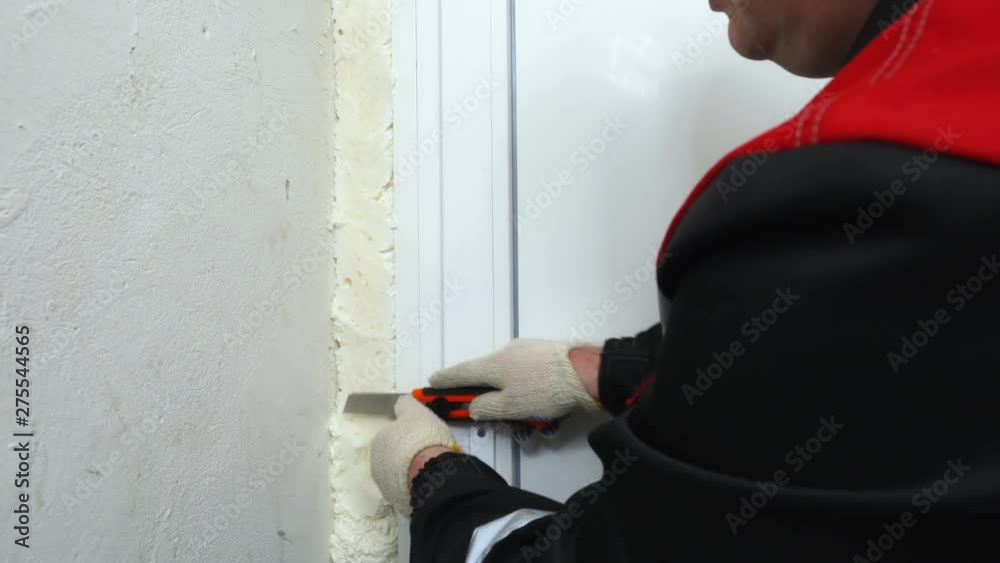 Home renovation new plastic white PVC door installation. Door frame ...