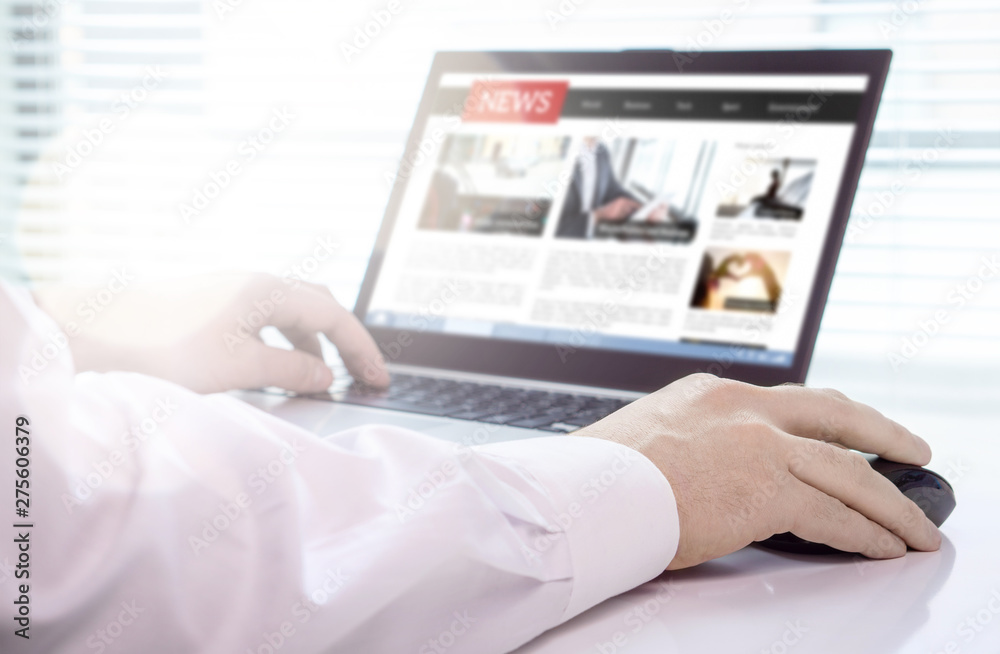 Reader, journalist or writer with online news article on laptop screen ...