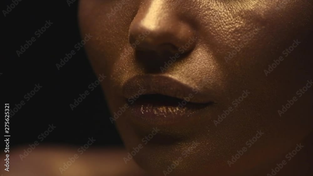 Beautiful sexy girl with golden skin. Fashion model woman in golden ...