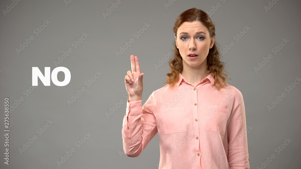 Lady saying no in sign language, text on background, communication for ...