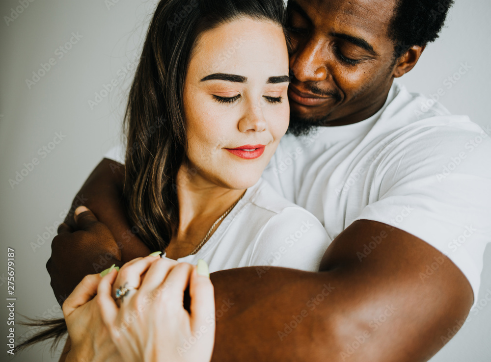 Happy Biracial Couple in Modern White Room Stock Photo | Adobe Stock