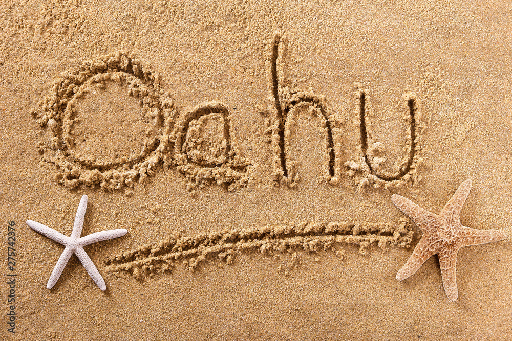 Oahu word written in sand on a sunny hawaii hawaiian summer beach with ...