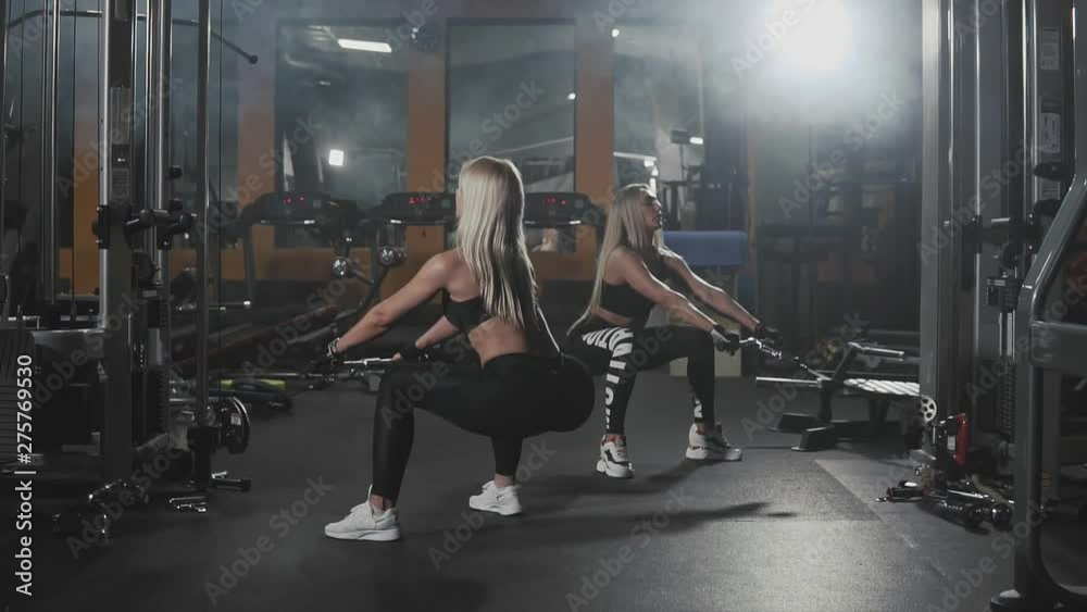 Fitness woman squat for strengthening legs and buttocks. Blonde squat ...