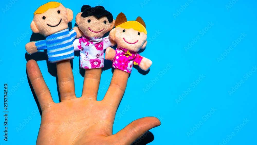 Puppet theater. Hand wearing finger family members puppets: mom, father ...