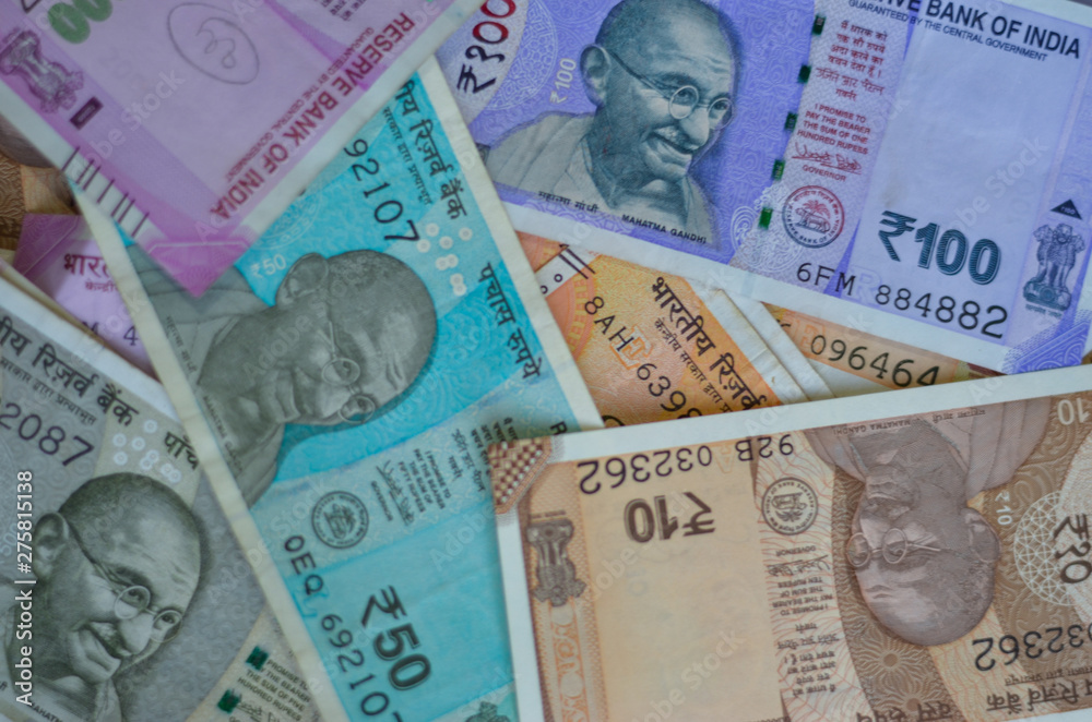 Closeup of brand new colorful Indian currency bank notes of 10, 50, 100 ...