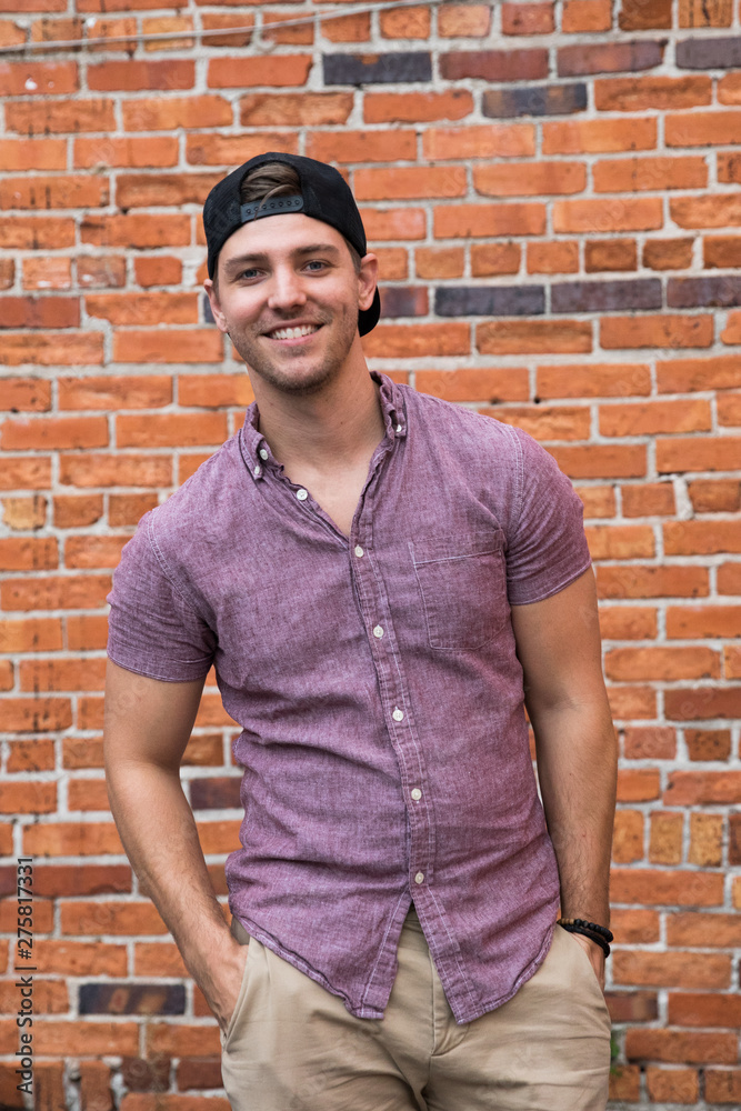 Handsome Young Caucasian Man with Backwards Hat Smiling for Portraits ...