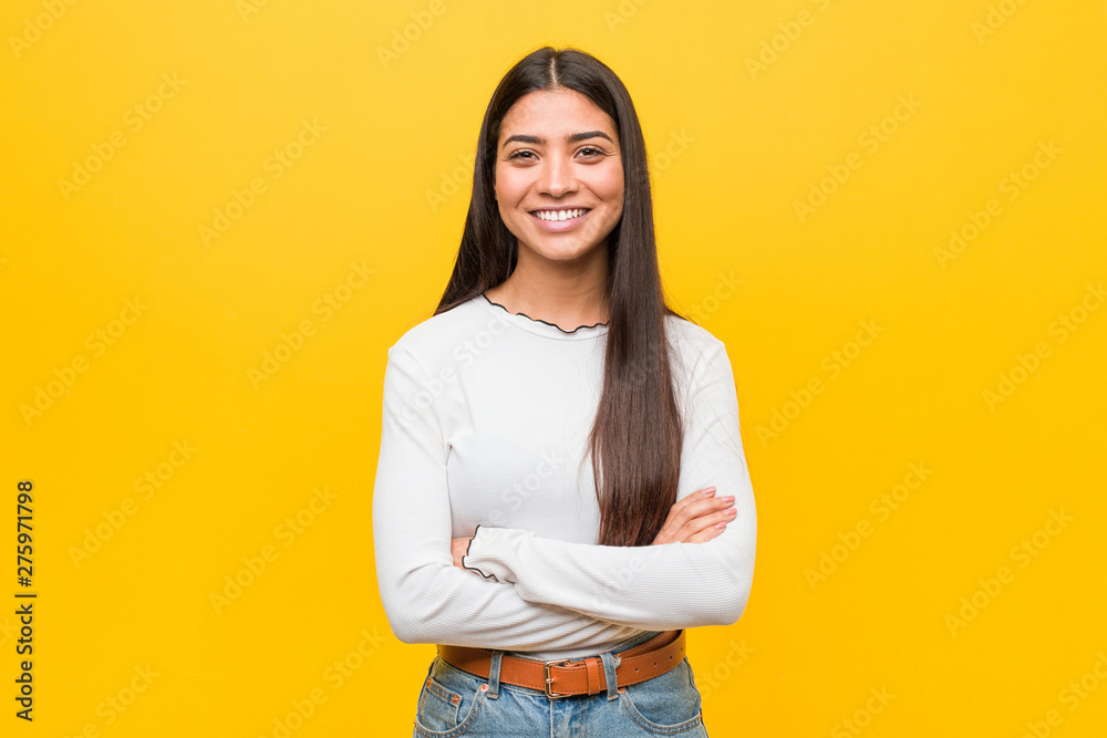 Young pretty arab woman against a yellow background who feels confident ...