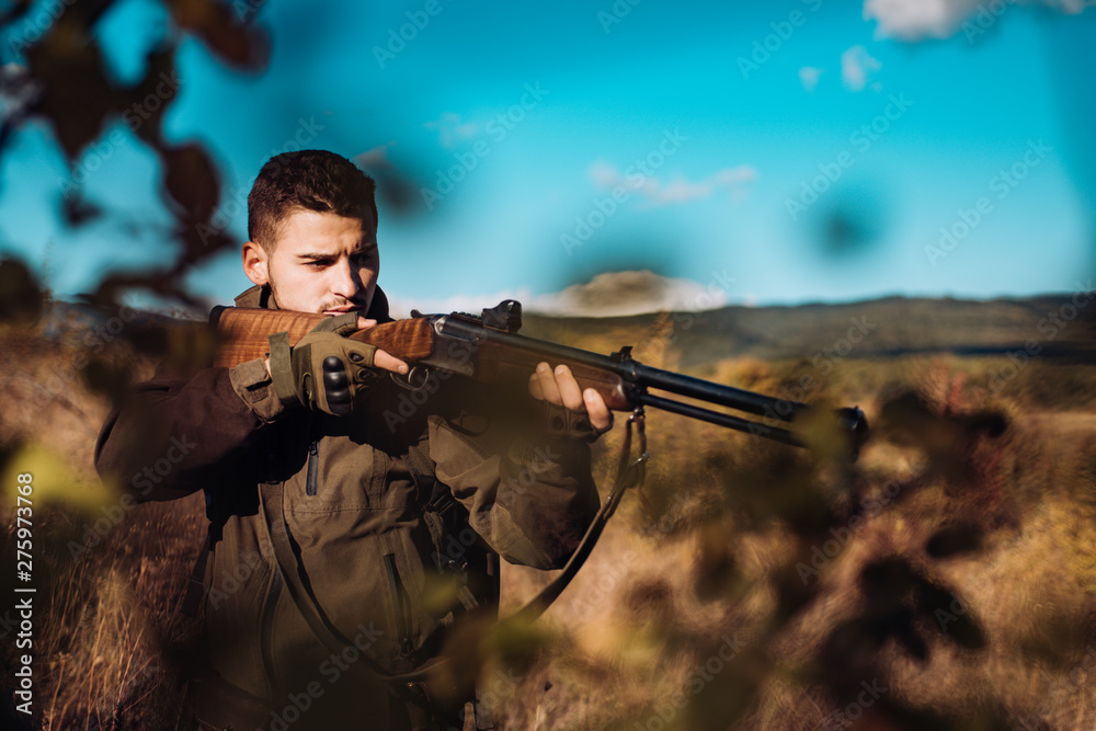 Hunter with shotgun gun on hunt. Process of duck hunting. Hunter with a ...