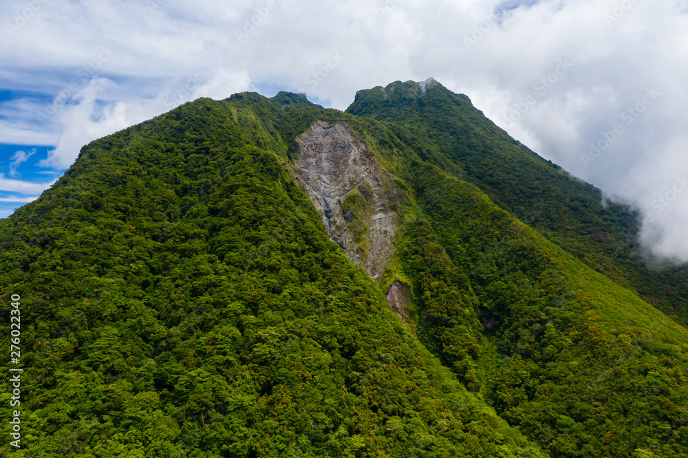 Cloud on the flanks of Mount Mambajo volcano on Camiguin island ...