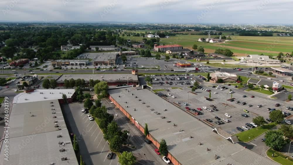 Aerial pan across suburban outlet mall at Rockvale, Lancaster ...