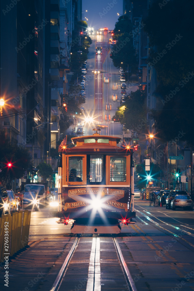 Classic view of historic traditional Cable Cars riding on famous ...