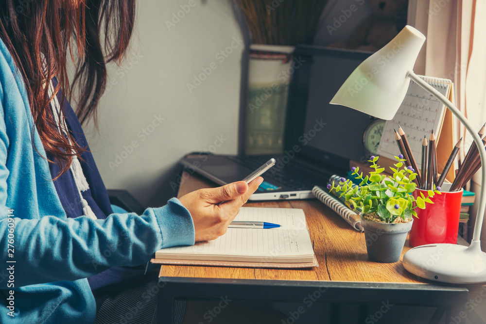 Study and technology concept.Person side view of sad woman holding ...