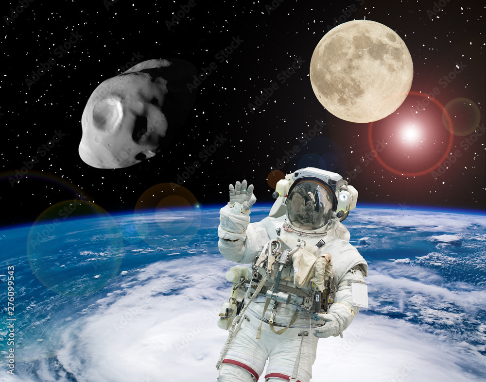 Astronauts flying in outer space. Moon on the backdrop. Space scene ...