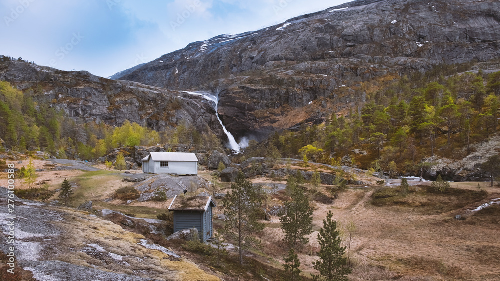 Norway natural landscape, a waterfall in the valley of the Husedalen ...