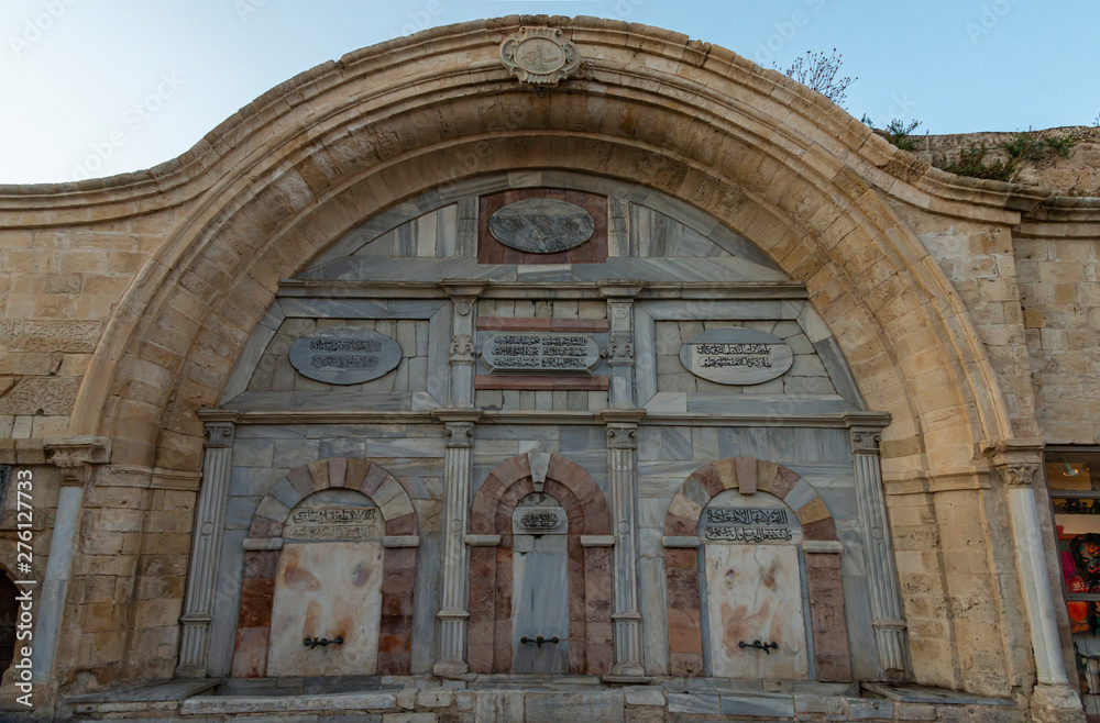 Wall with taps of the fountain Sabil Suleiman at the Mahmoudiya Mosque ...