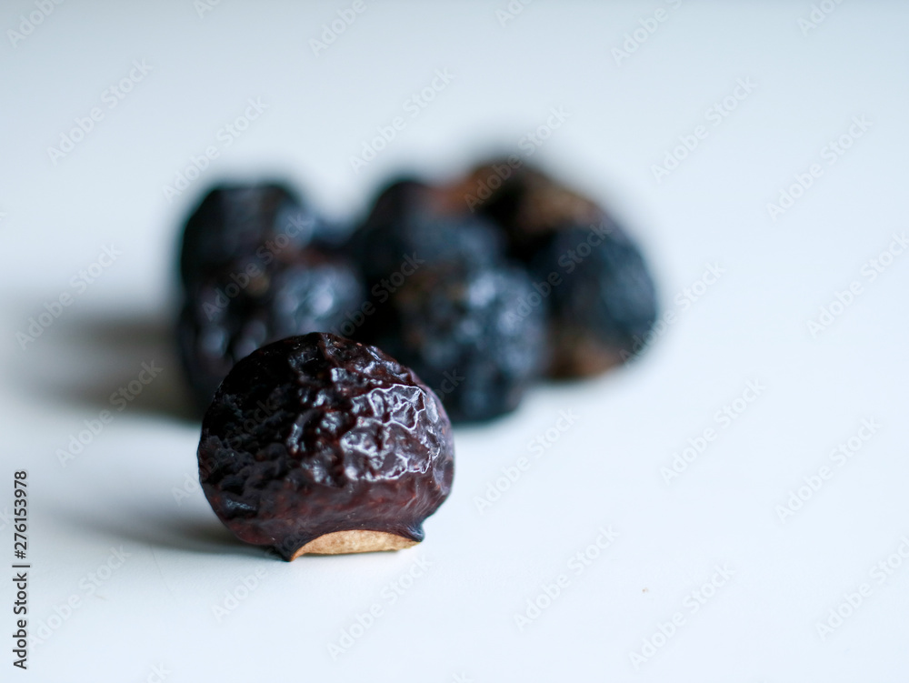 Sapindus rarak (lerak) on white background. In Indonesia lerak is used ...