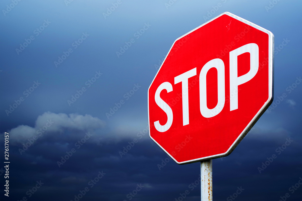 Conceptual stop sign with stormy background. Warning, caution and ...