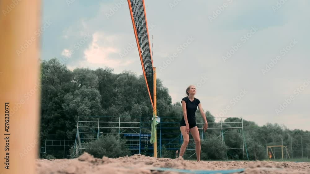 Four girls playing volleyball on the beach. Beach volleyball, net ...