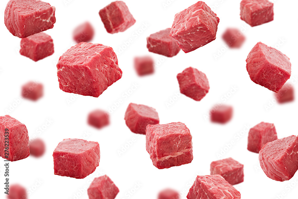 Falling meat, beef, cube, isolated on white background, selective focus ...