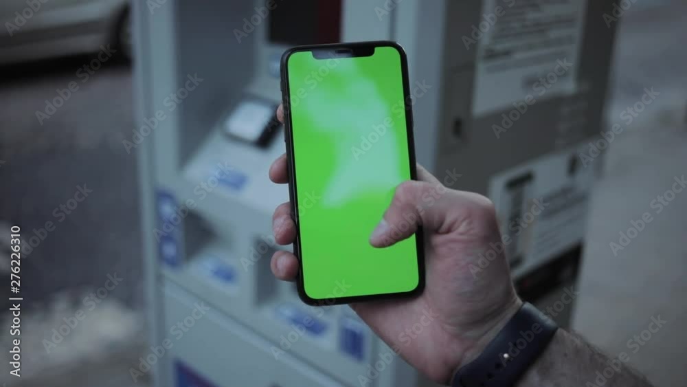 Close up man hands using phone with vertical green screen smart mobile ...