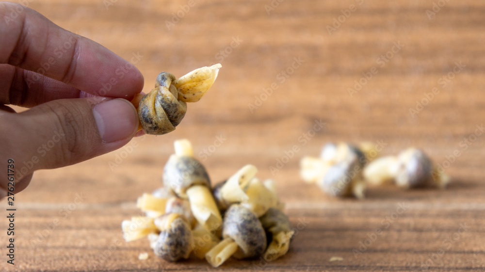 Traditional malay food or snack known as popia simpul kasih with ...