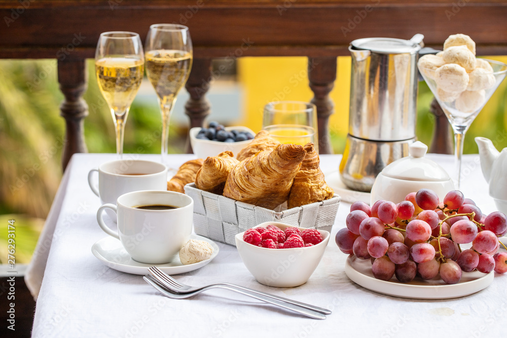 Luxury brunch on the hotel terrace, coffee maker, teapot, cups ...