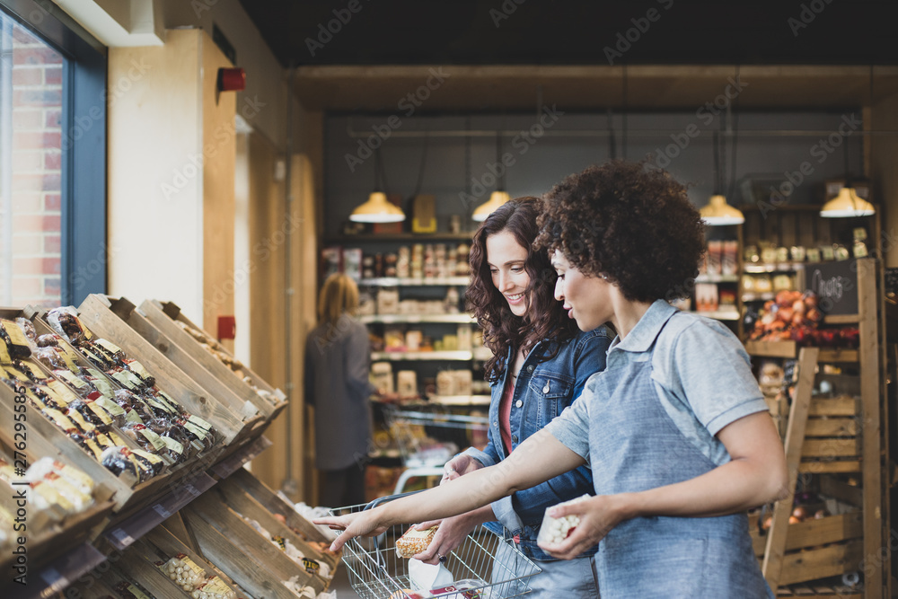 Customer asking for help in a grocery store Stock Photo | Adobe Stock