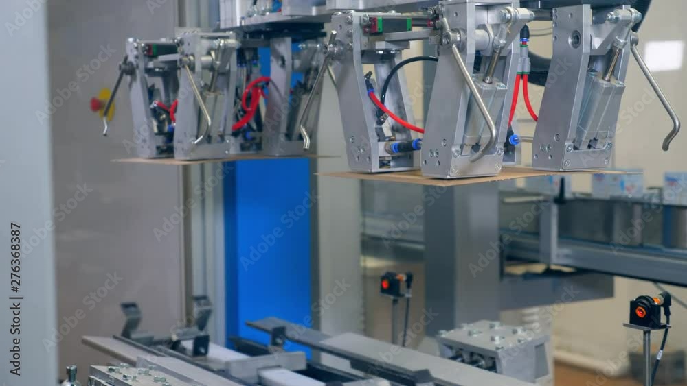 Robotic production line work at a factory, automated assembly line ...