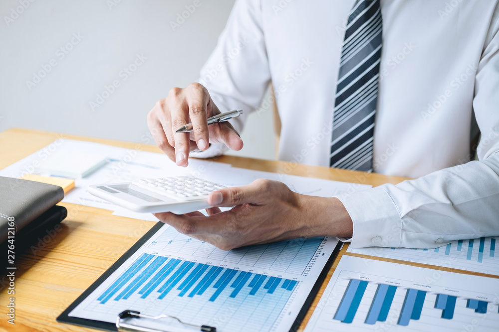 Businessman accountant working analyzing and calculating expense ...