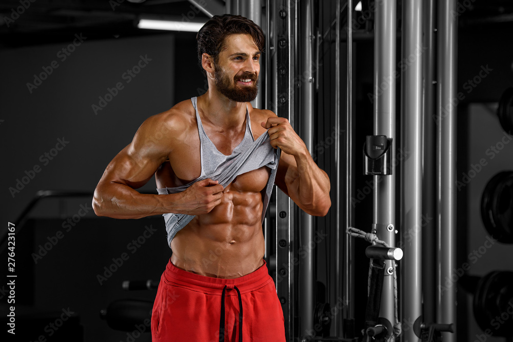 Got Abs? Handsome Men In the Gym Showing, Checking Abdominal Muscles ...