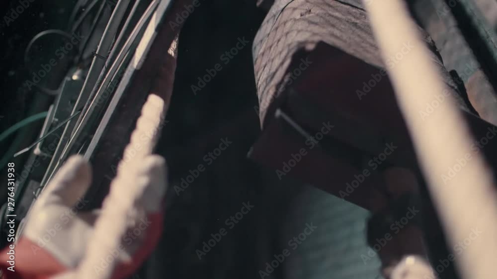 Pulls the rope. Man pulls the rope in theatre backstage. Detail of rope ...