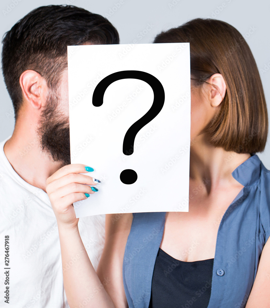 Problem in couple, question mark. Couple holding paper question mark ...