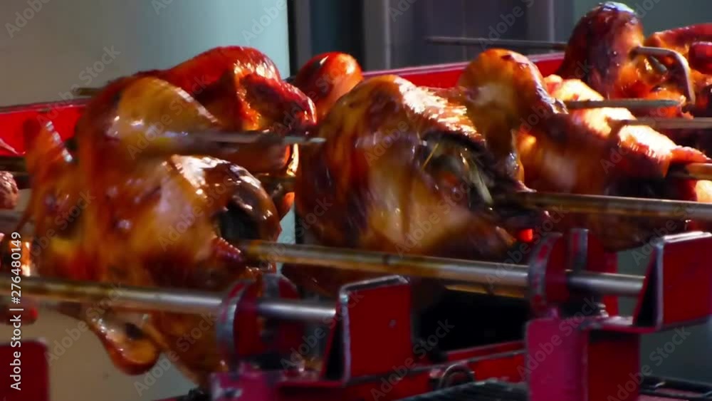 Philippine rotisserie for broiling chicken or "lechon manok." Stock Video | Adobe Stock