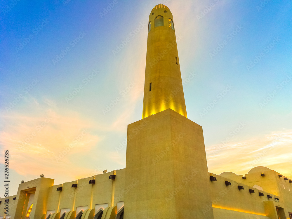 Closeup of State Grand Mosque with a minaret at sunset light. Doha ...