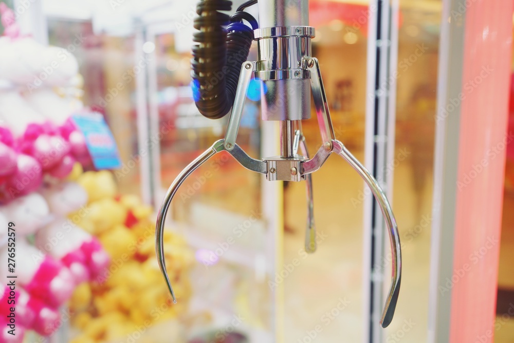 Machine claw grabber game in a vending machine close up Stock Photo ...