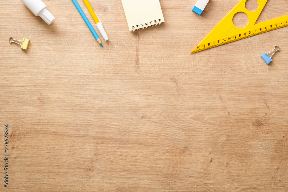 Modern school supplies on wooden desk table background. Back to school ...
