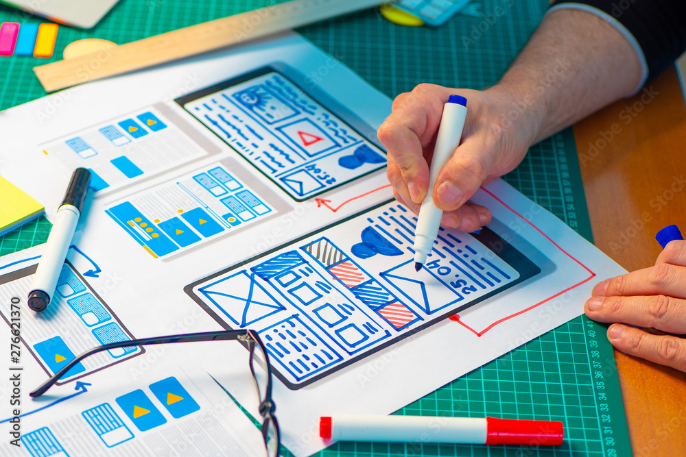 Ux ui design. Graphic designer draws how the mobile application will ...