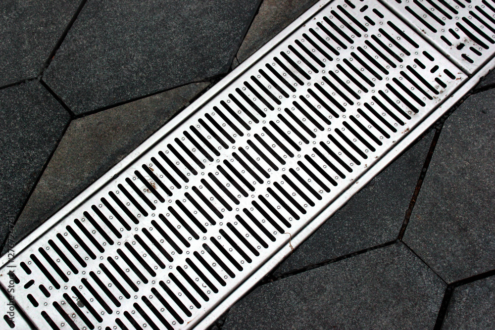 Street gutter of a stormwater drainage system on a sidewalk Stock Photo ...