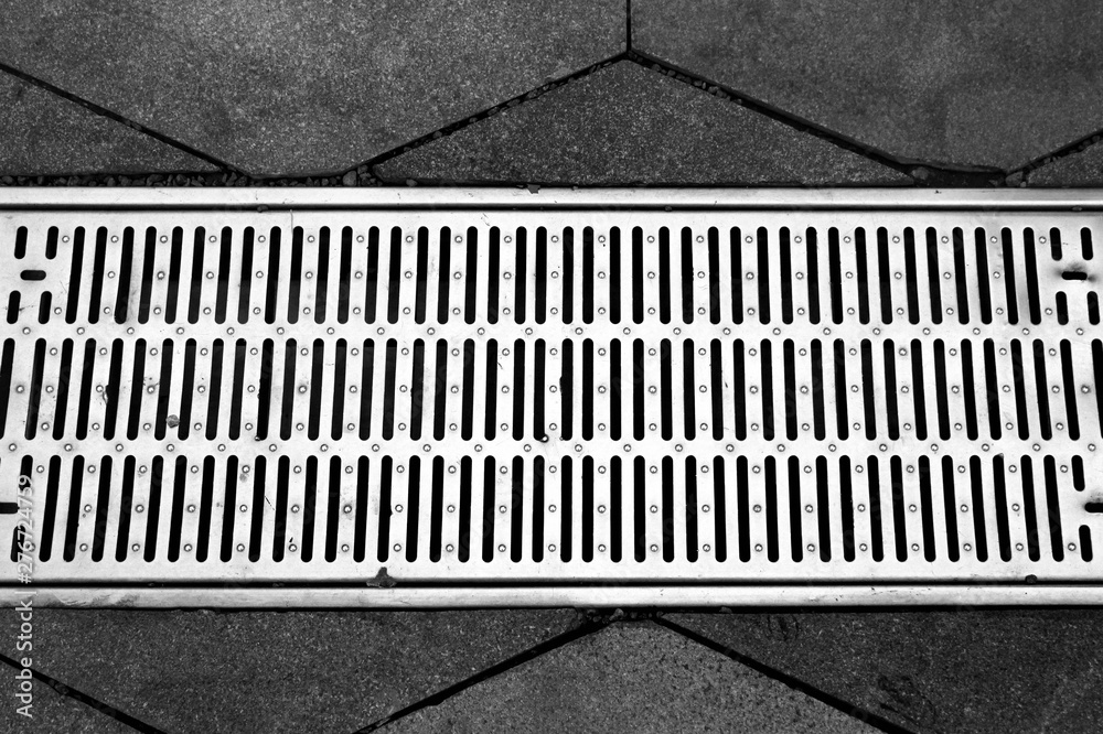 Street gutter of a stormwater drainage system on a sidewalk Stock Photo ...