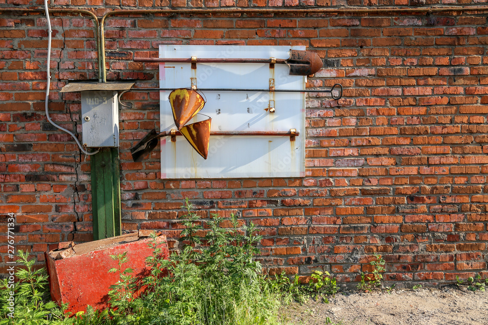 Fire safety, white shield of fire safety. Brick wall with a fire shield ...