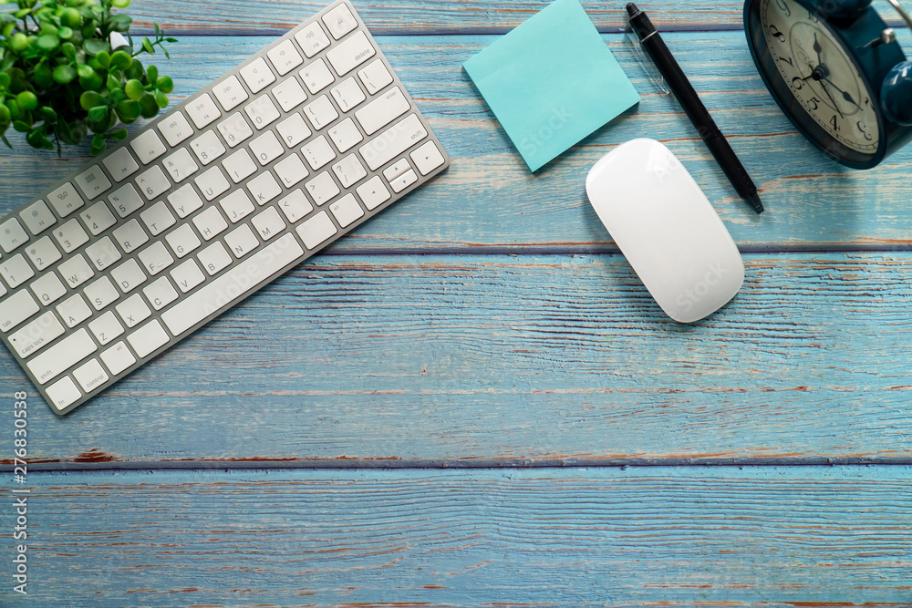 Blue wood office desk table with computer keyboard and other office ...