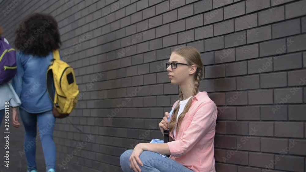 Female students bullying scared modest schoolgirl in eyeglasses ...