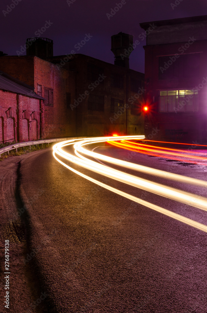movement of the light of car headlights. night traffic in the city ...