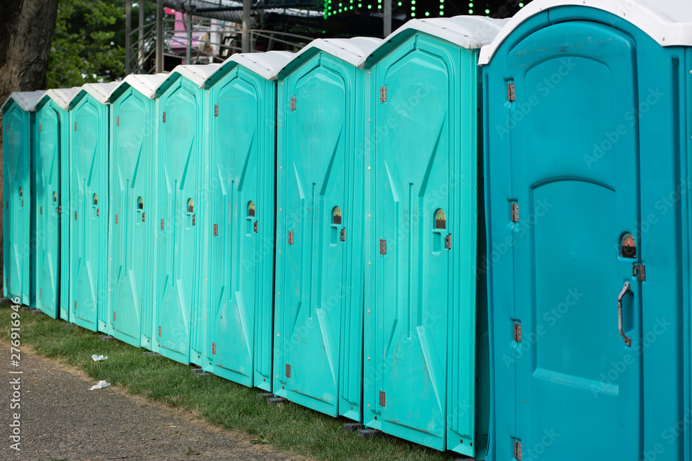 Porta Potty Row and Carnival Rides At Local Independence Day ...