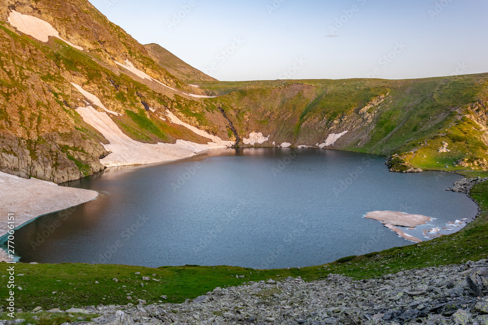 Sunrise view of The eye lake, one of the seven rila lakes in Bulgaria ...