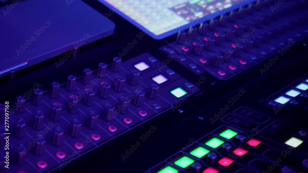 Remote control for adjusting the sound. Audio mixer. Sound engineer ...